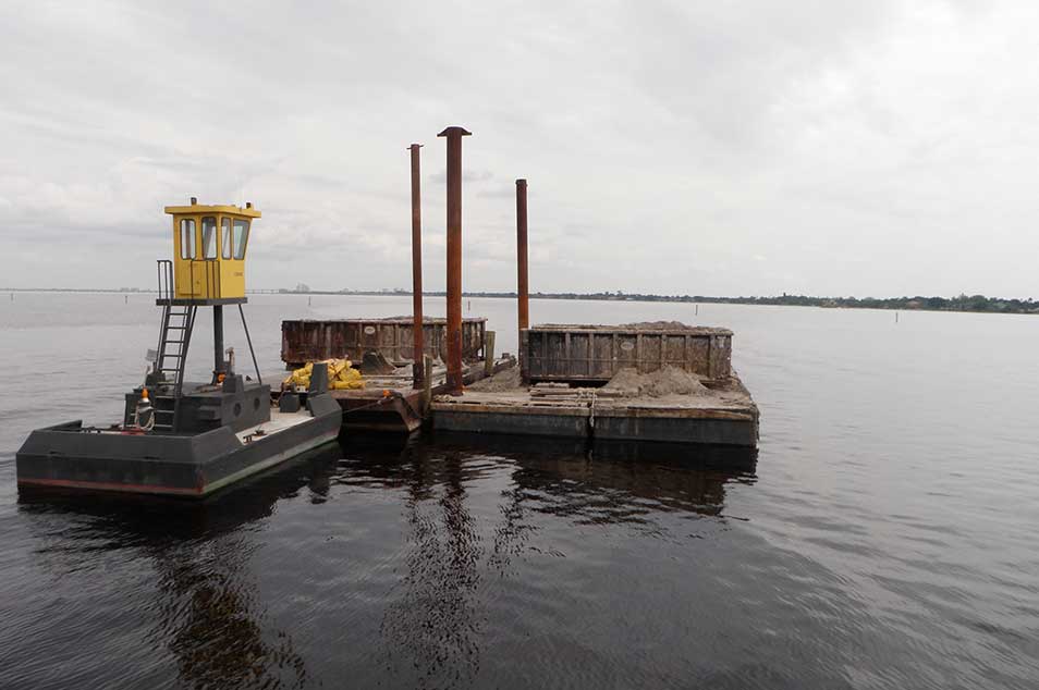 Modular dredge ferry barges awaiting spoil unloading. | Florida Marine ...
