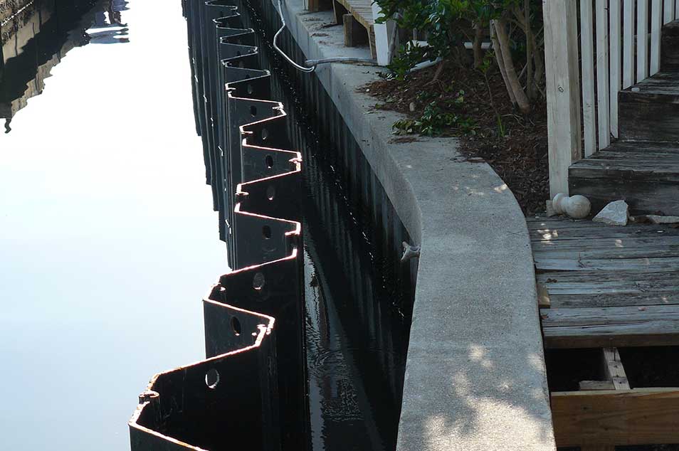 Vista of Steel Sheet piling installed 18” in front of concrete seawall ...